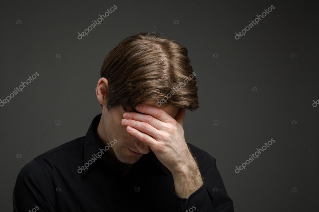 Model ashamed hiding face in hand Stock Photo by ©Bruno135 73115721