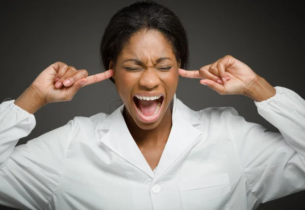 Model plugging ears with fingers Stock Photo by ©Bruno135 78719016