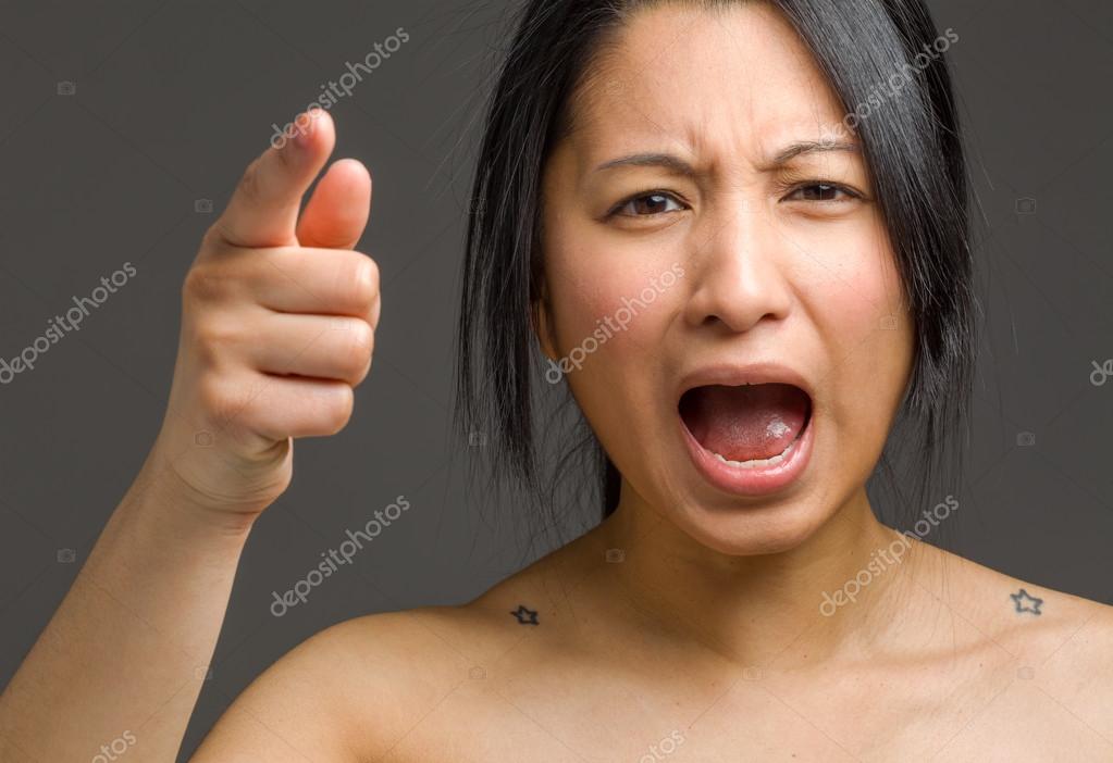 Angry Model scolding and pointing Stock Photo by ©Bruno135 78816434