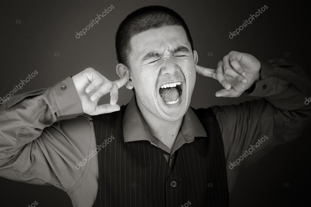 Model plugging ears with fingers Stock Photo by ©Bruno135 78832702