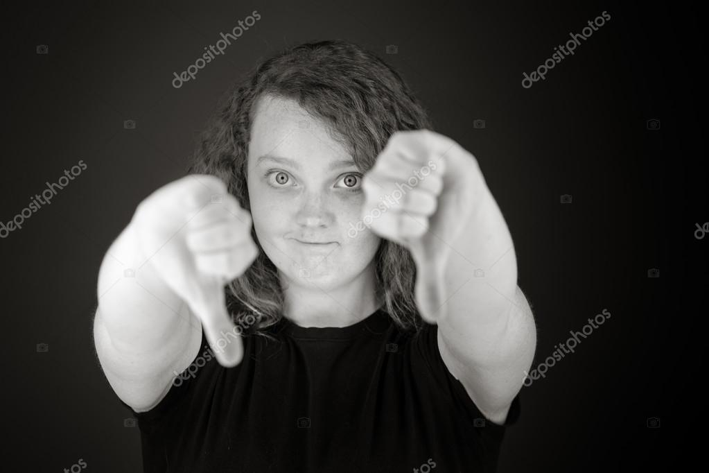 Negative model showing thumbs down Stock Photo by ©Bruno135 78836026