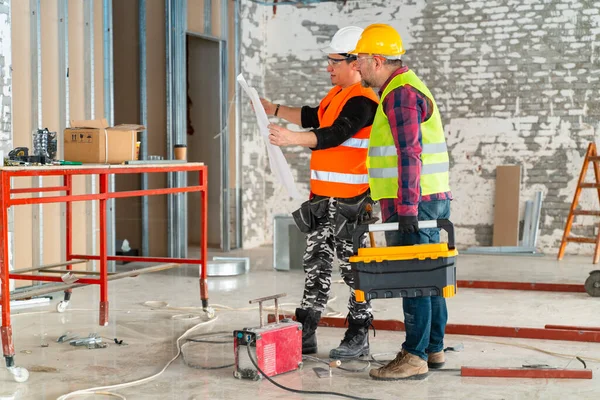 Construction Workers Architect Holding Blueprint Looking Construction ...