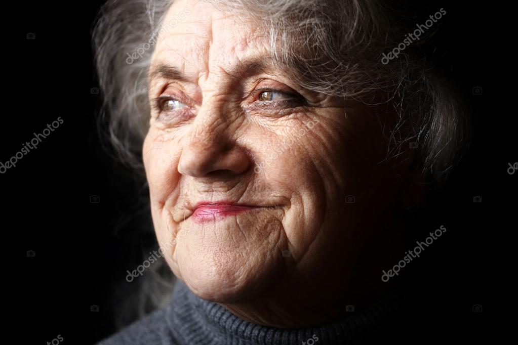 Granny face on a black background Stock Photo by ©pavelkubarkov 118116586