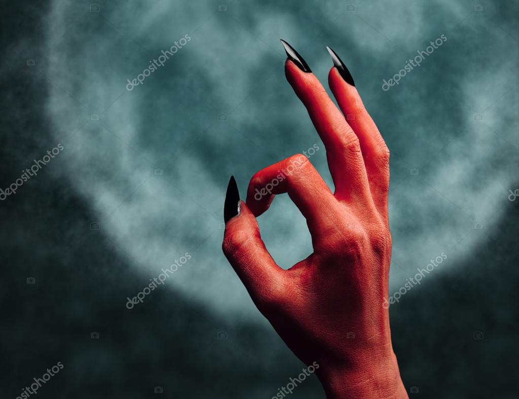 Devil hand with gesture OK at midnight Stock Photo by ©Remains 54339981