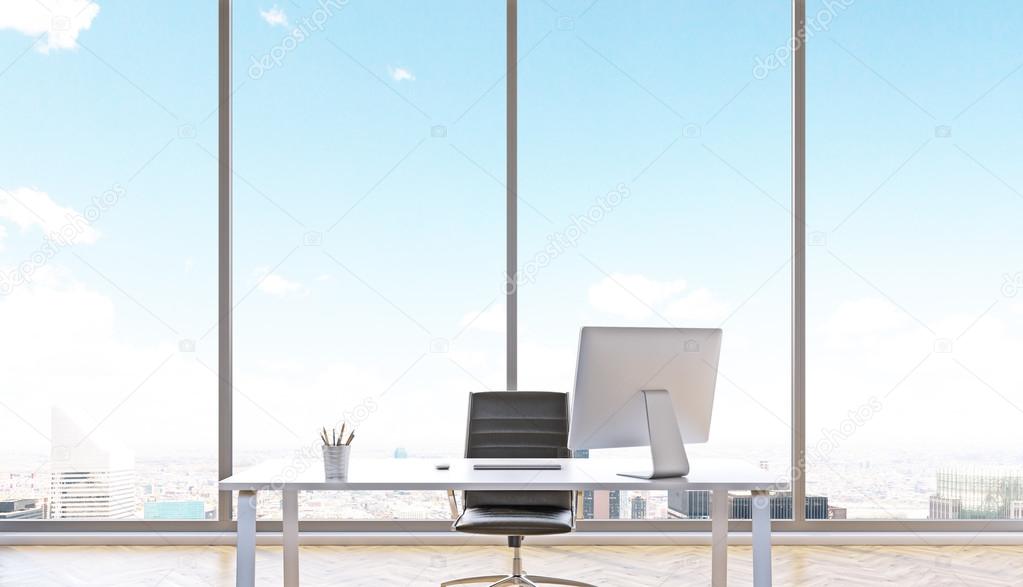 Table with computer for one, office. Panoramic window behind, blue sky ...