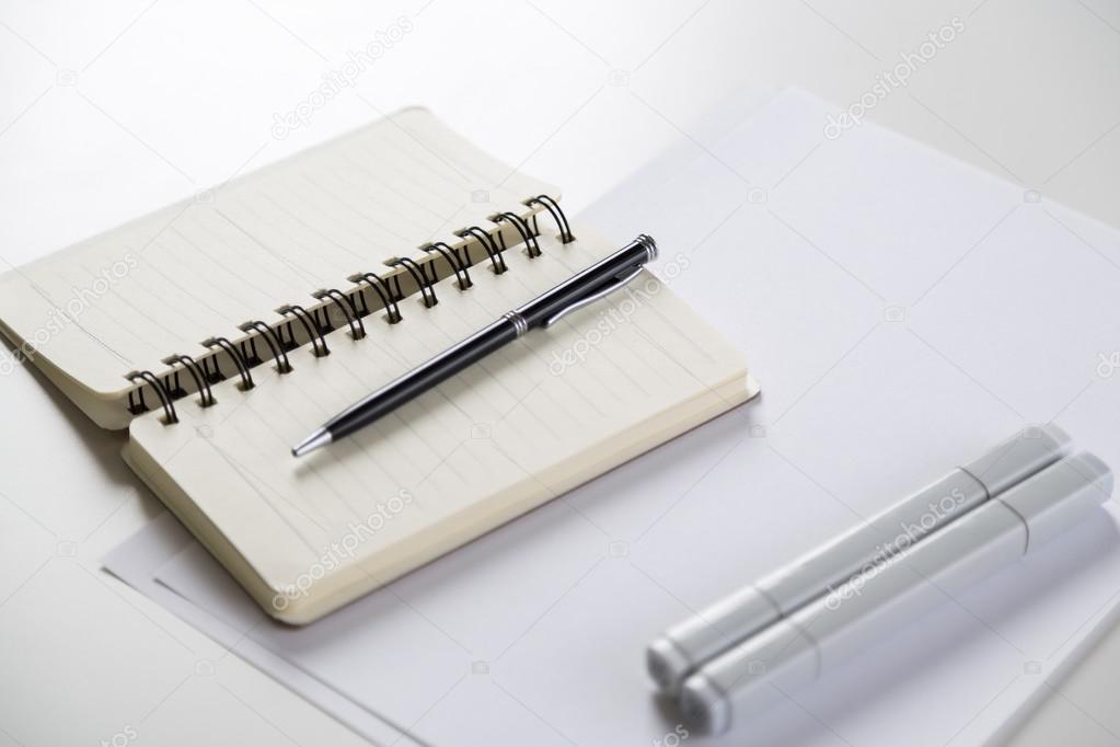 Notepad, pen and markers Stock Photo by ©denisismagilov 108060328