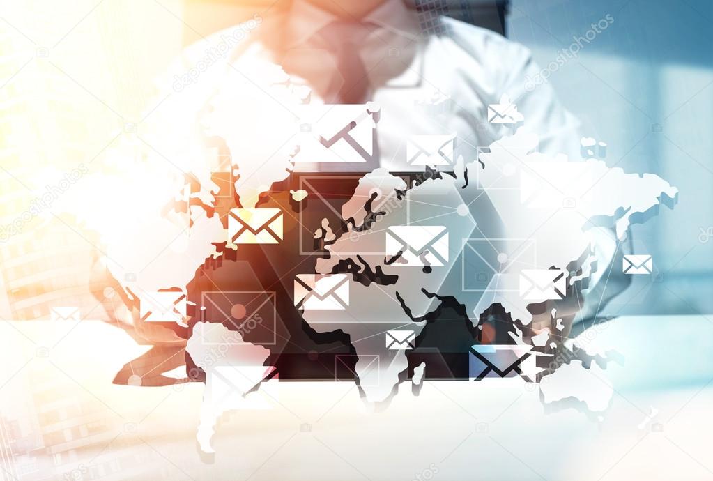 Email network on map with businessperson using computer in the ...