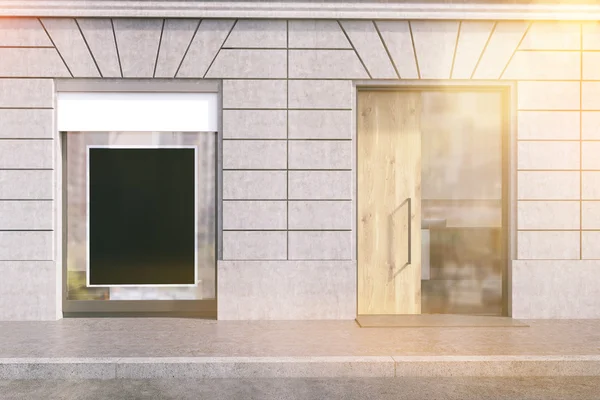 Side view of shop window with black poster and door. Concept of inset ...