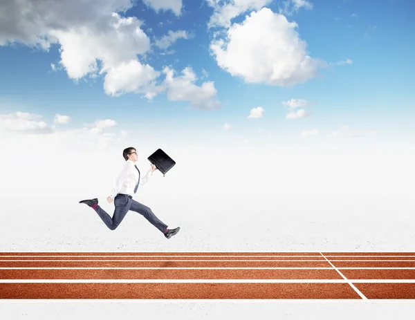 A young businessman running forward with a black folder in hand ...