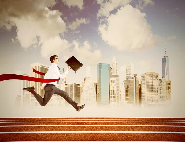 A young businessman running forward on track with a black folder in ...