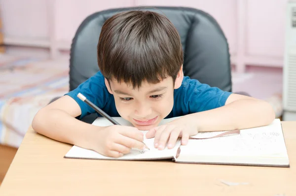 Little boy coloring image lay on th floor Stock Photo by ©wckiw 71927407