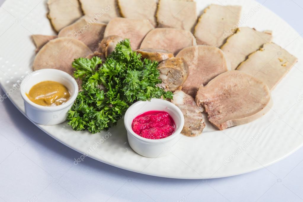 Boiled tongue on a plate Stock Photo by ©aallm 107489826