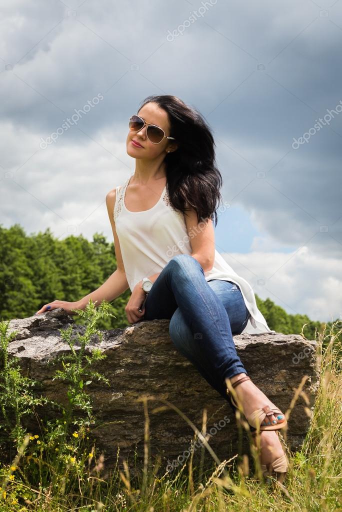 Woman on stone — Stock Photo © aallm #52259643