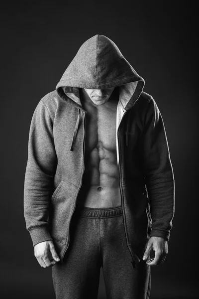 Man with open jacket revealing muscular chest - Stock Image - Everypixel