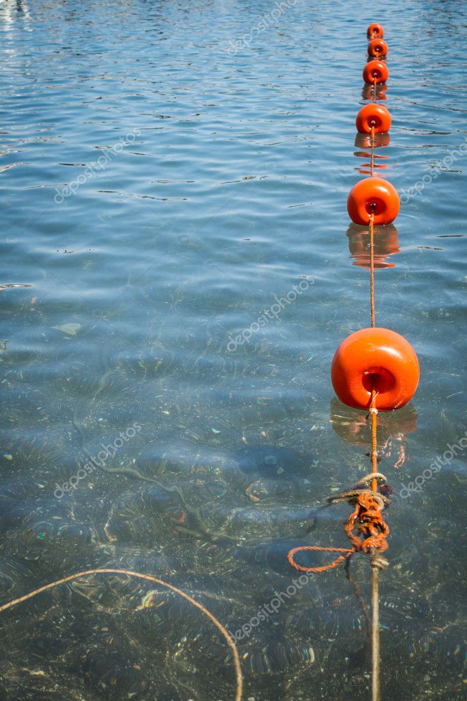 Red buoy row in sea — Stock Photo © aallm #62513427