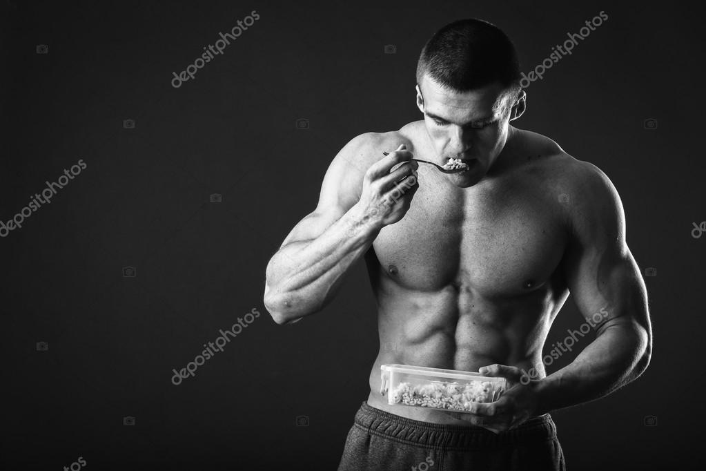 Bodybuilder eating sport food — Stock Photo © aallm #67623119