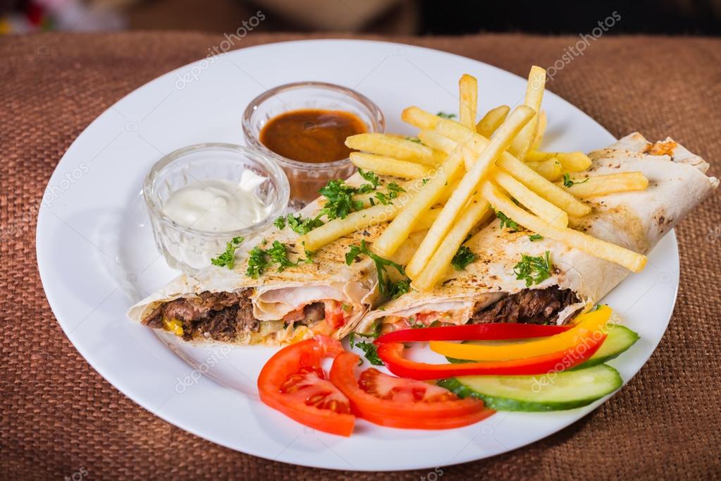 Shawarma with potatoes and vegetables Stock Photo by ©aallm 70440173