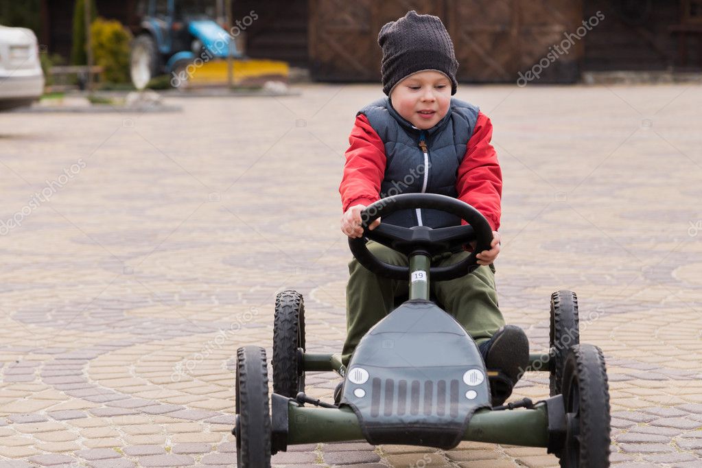 Boy in toy car Stock Photo by ©aallm 74253763