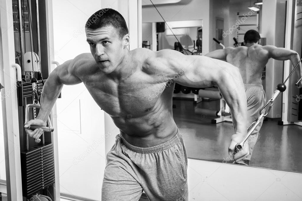 Man doing exercise on simulator — Stock Photo © aallm #76640277