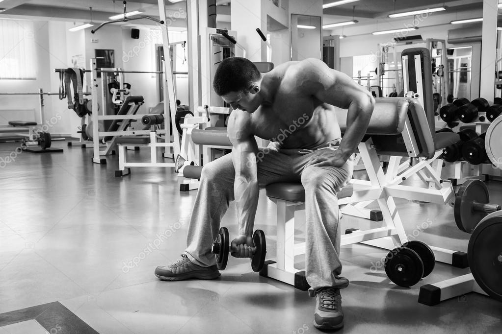 Strength training professional athlete in the gym — Stock Photo © aallm ...