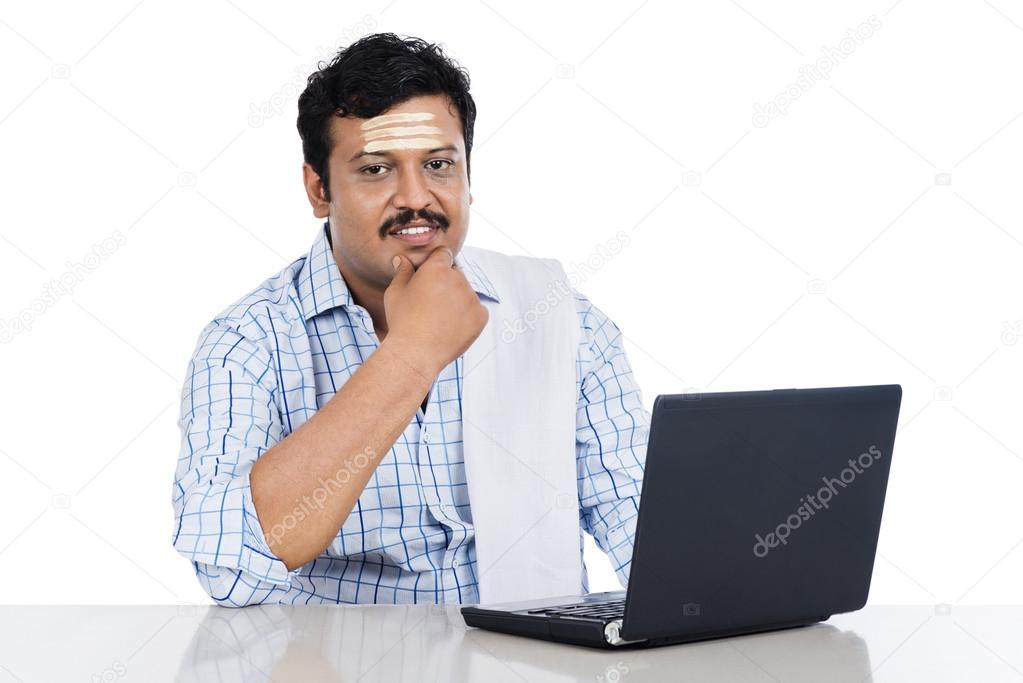 Portrait of a South Indian man using a laptop — Stock Photo © imagedb ...