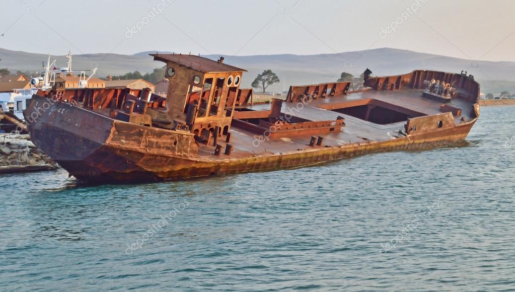 Old barge sunk at the wharf Stock Photo by ©avtor_hell 80393830