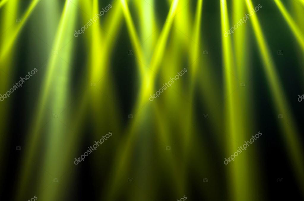 Yellow luminous rays on a dark background Stock Photo by ©Tzido 55983729