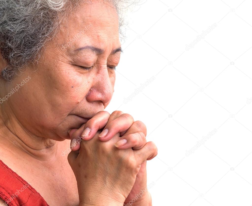 Old woman praying on white background Stock Photo by ©Tzido 74593417