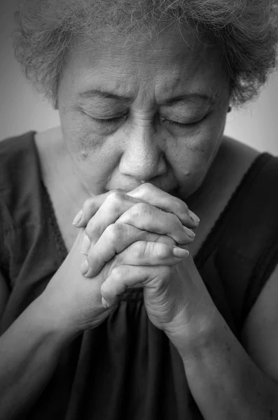 Old woman praying Stock Photo by ©Tzido 74593433