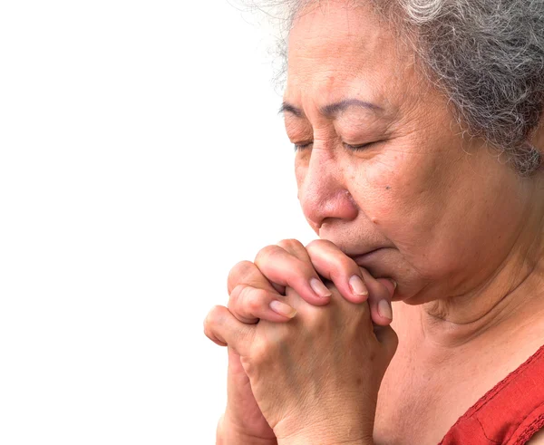 Old woman praying on white background Stock Photo by ©Tzido 74593417