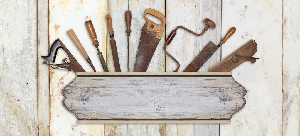 Signboard and carpenter tools on wooden background — Stock Photo ...