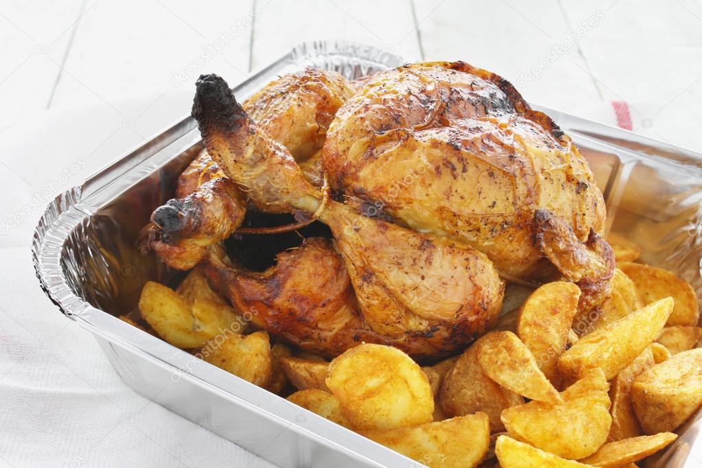Roast chicken takeaway dinner Stock Photo by ©neillangan 121305784