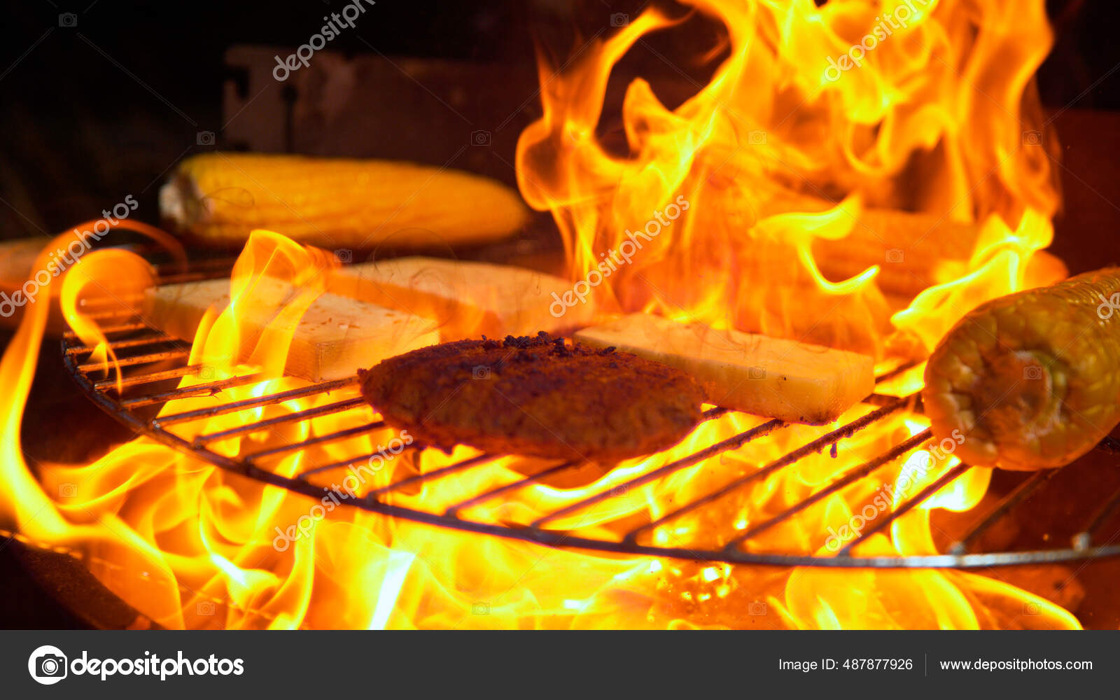 MACRO, DOF: Burning fire roasting the tofu and corn on the charcoal ...