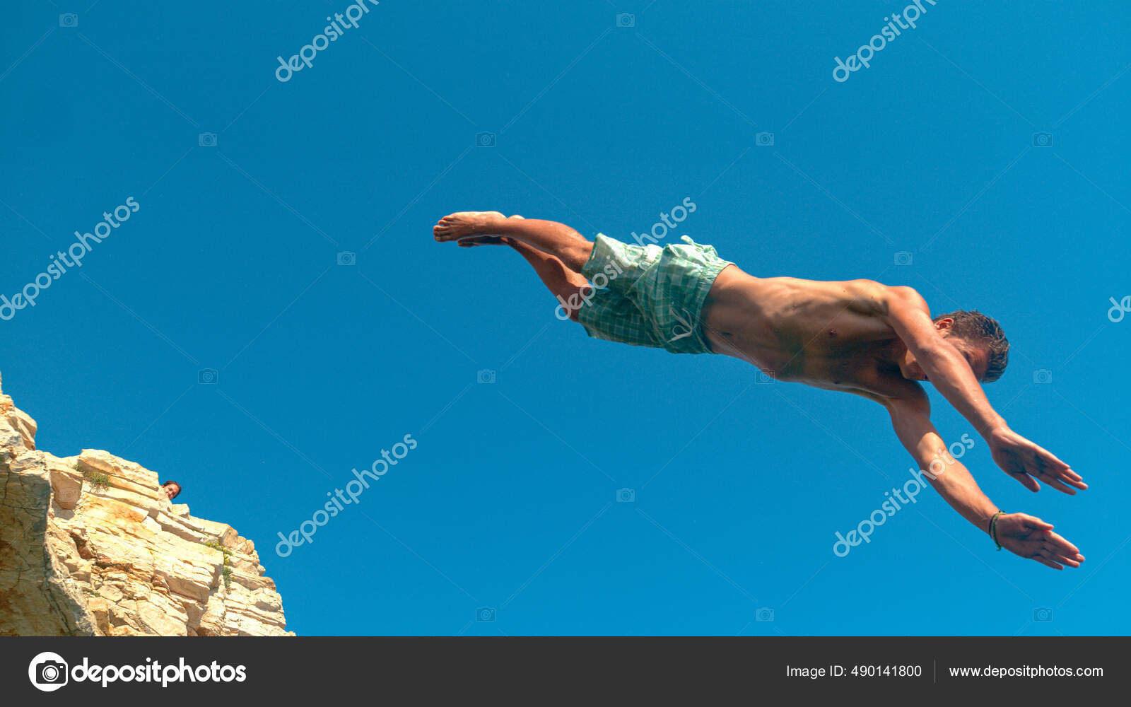 Person Diving Off Cliff