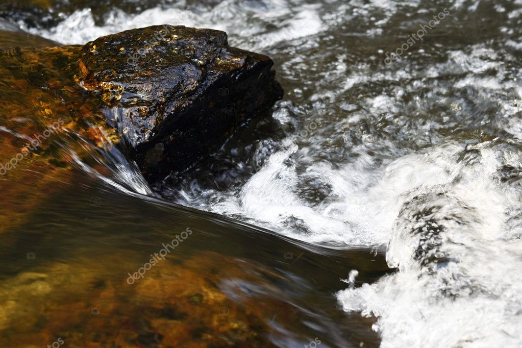 Rock and water stream in nature — Stock Photo © kittimages #98383402