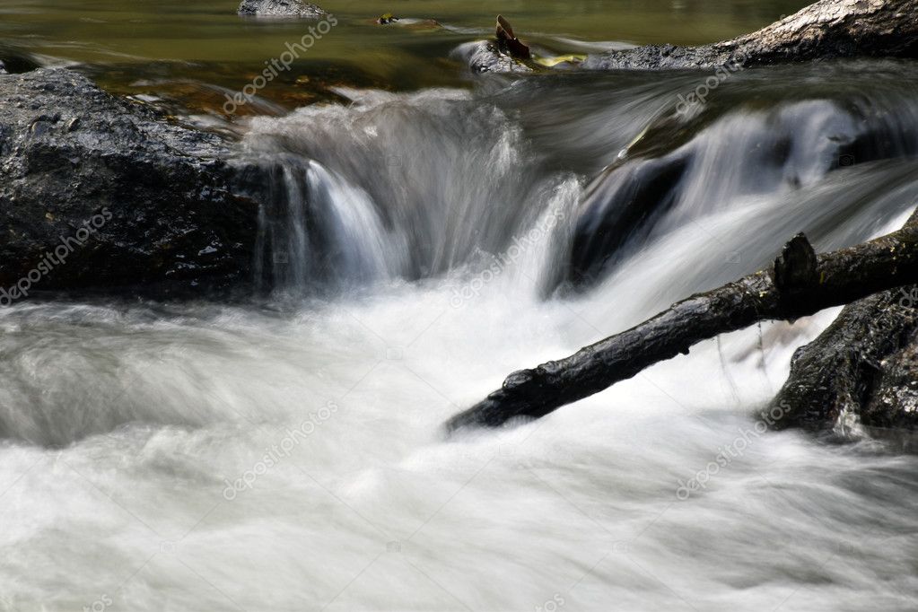 Rock and water stream in nature — Stock Photo © kittimages #98383450