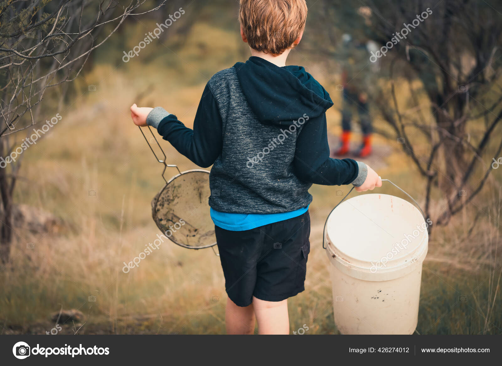Back View Little Boy Walking Buckets — Stock Photo © Wirestock #426274012