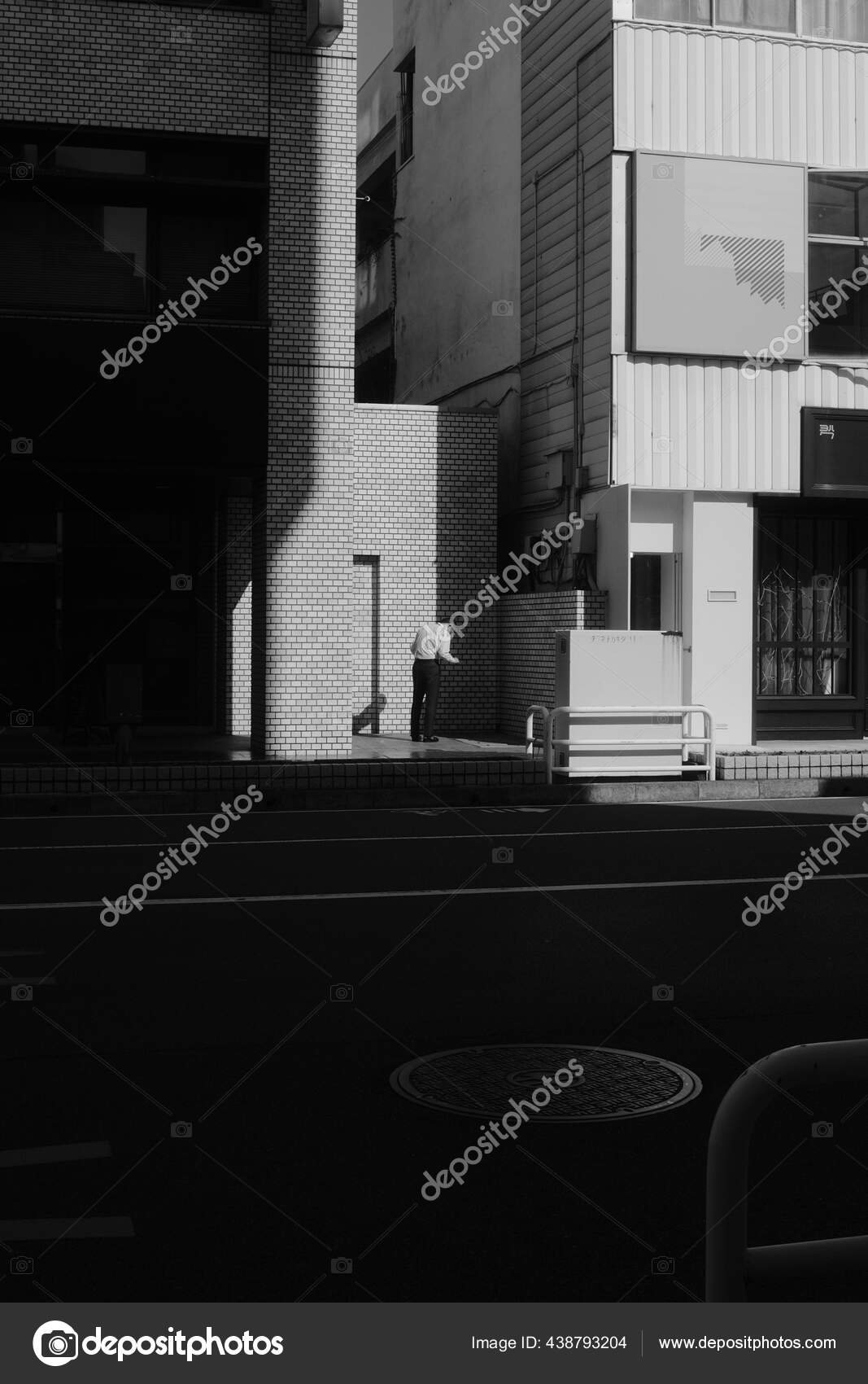 Grayscale Shot Buildings Street Man Standing Backward — Stock Photo ...