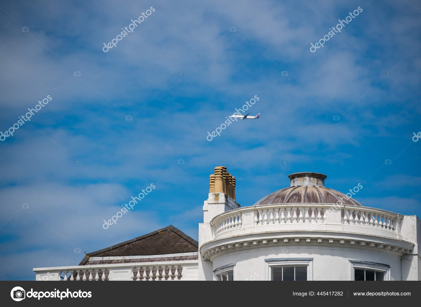 Plane Flying Roof White Stone Building Stock Photo by ©Wirestock 445417282