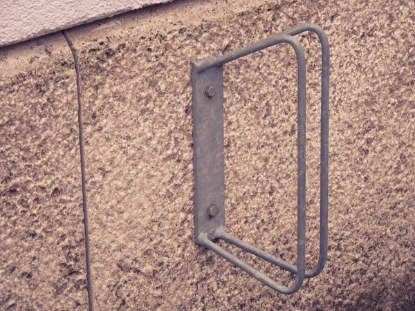 A closeup of a fixed wall-mounted cycle rack - Stock Image - Everypixel