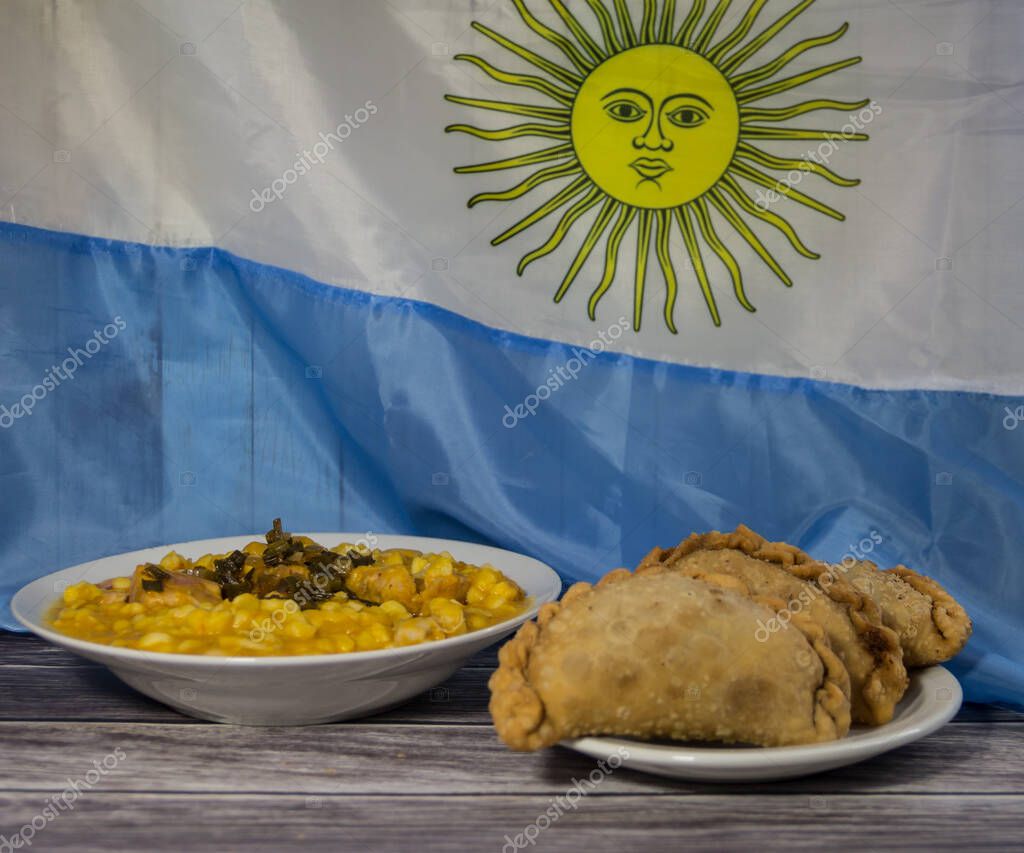 plato de locro y empanadas con la bandera argentina, comida patri tica ...