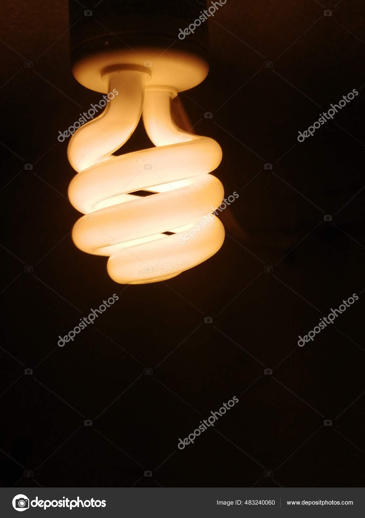 Vertical Shot Illuminated Twisting Lightbulb — Stock Photo © Wirestock ...