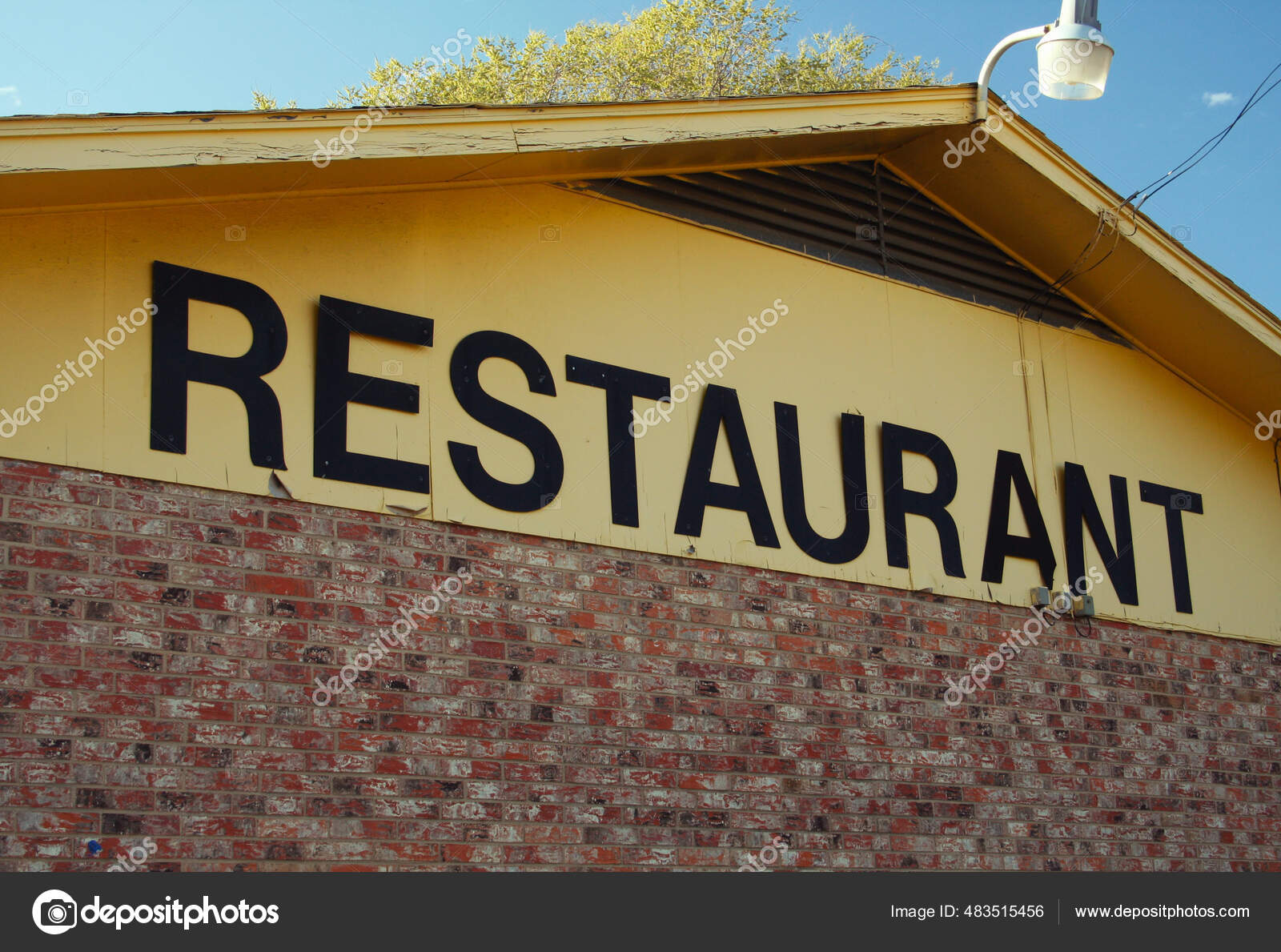 Written Restaurant Sign Building — Stock Photo © Wirestock #483515456