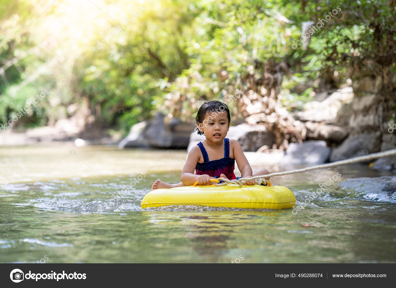 Cute Southeast Asian Female Child Yellow Floating Raft River Stock ...