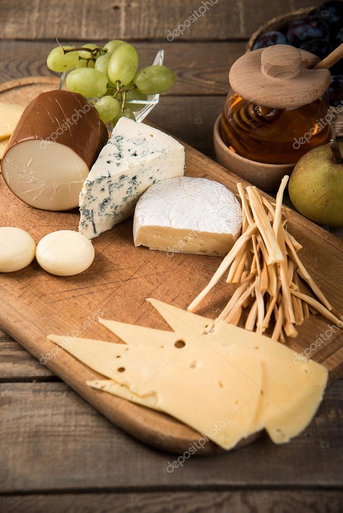 Assorted cheeses in various shapes and sizes Stock Photo by ©nata ...