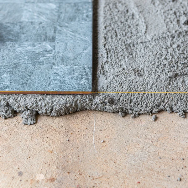 floor tile installation for house building - Stock Image - Everypixel