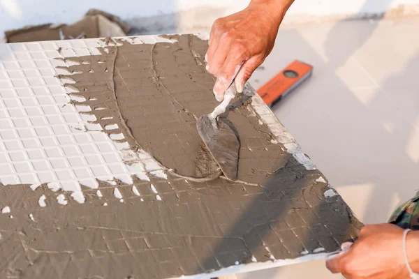 Installing tile Stock Photos, Royalty Free Installing tile Images ...