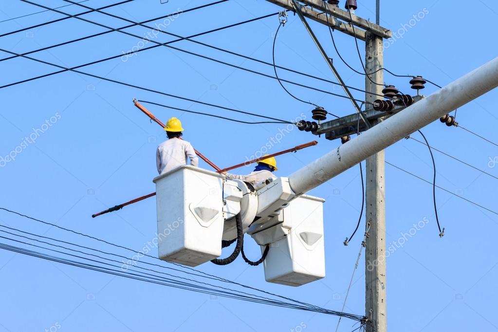 Electrician working on electric pole Stock Photo by ©wittybear 64487301
