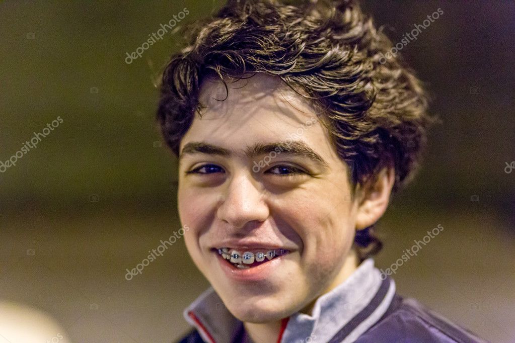 Boy with braces and reassuring smile — Stock Photo © GoneWithTheWind ...
