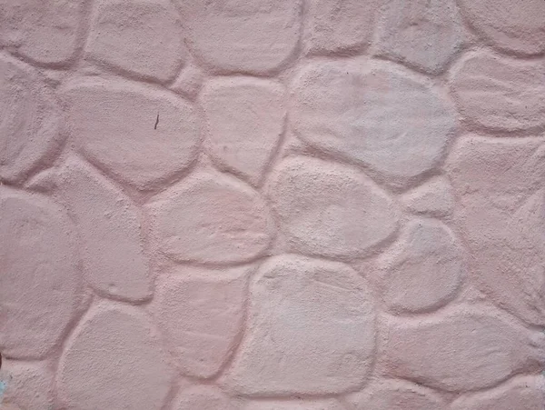 pink cement wall in huge stones, plaster background - Stock Image ...